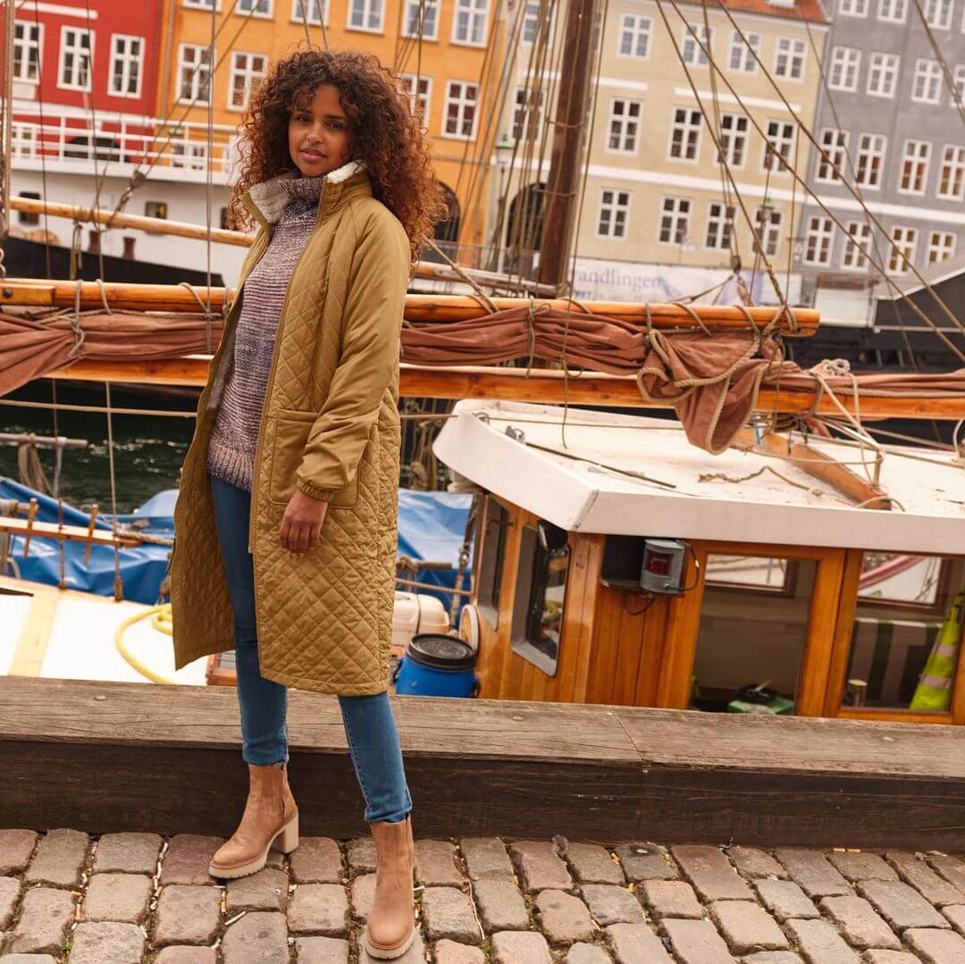 15 Sustainable Plus Size Winter Coats to Keep You Warm & Chic